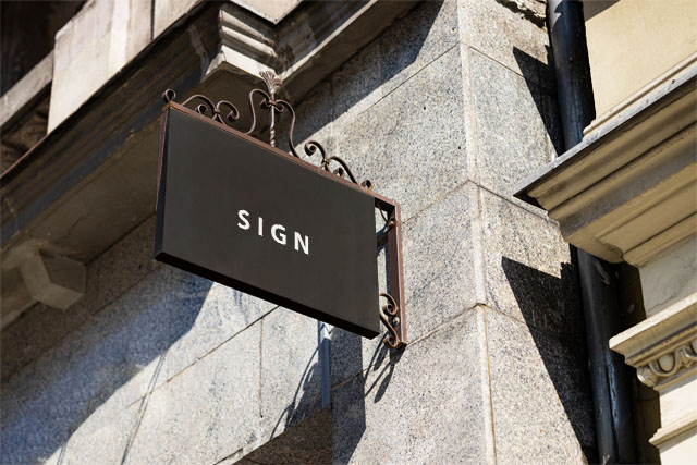 Rectangle street sign in the city mockup | MockupsJar