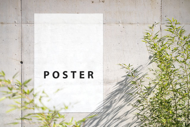 Poster on a concrete wall mockup | MockupsJar
