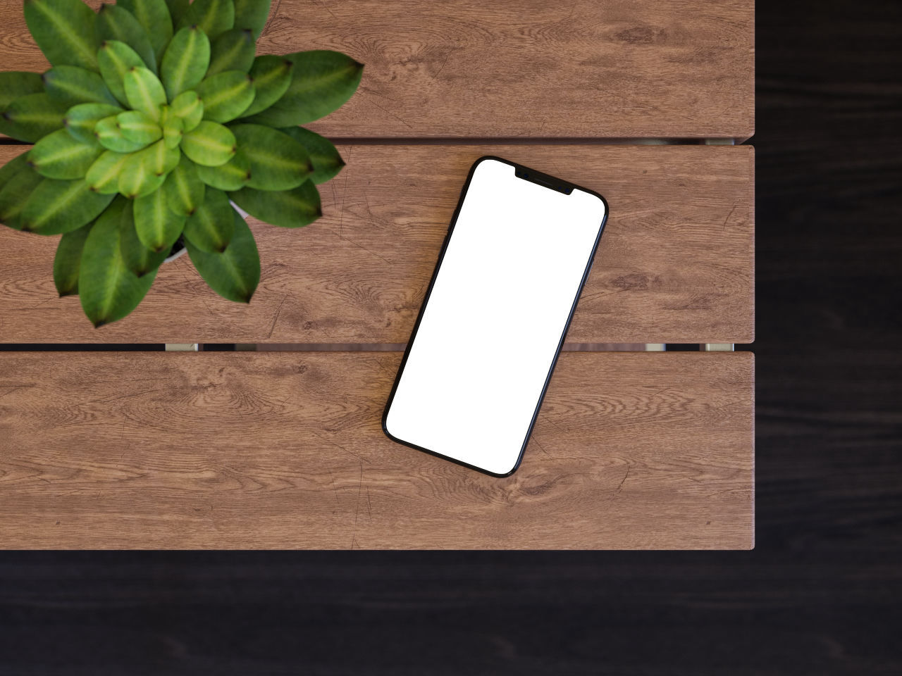 iPhone X On Table mockup | MockupsJar
