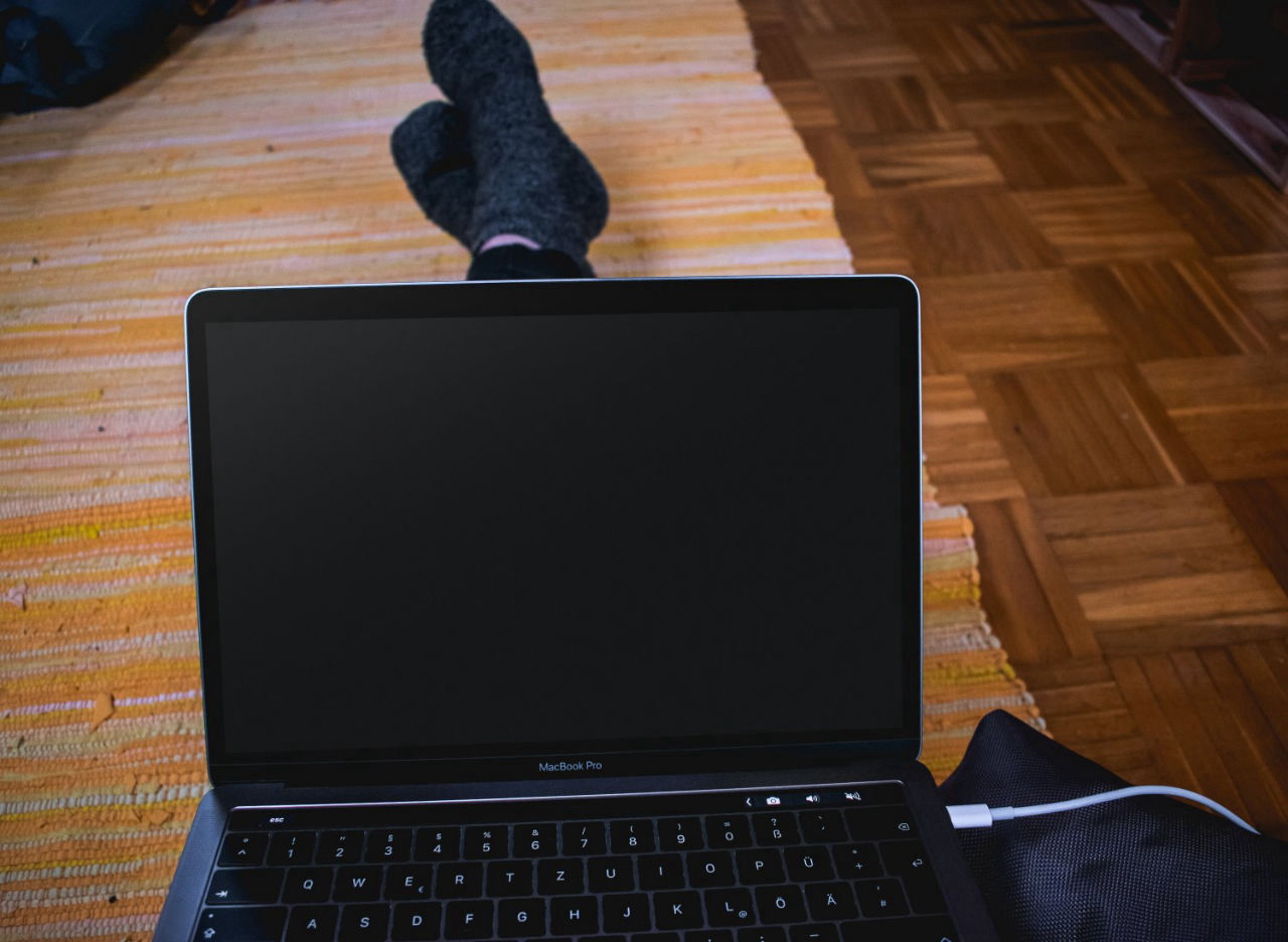 Man using MacBook Pro mockup | MockupsJar