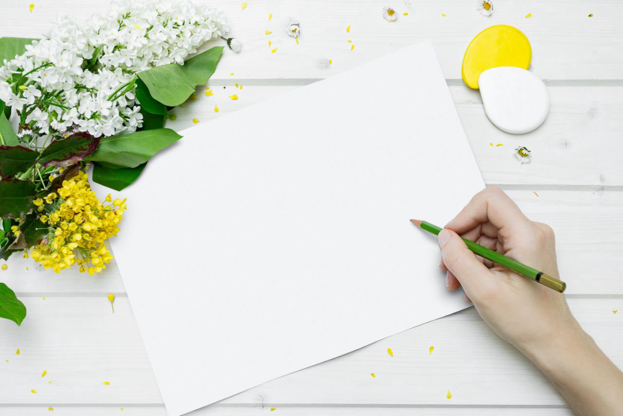 Woman drawing on A4 Paper mockup | MockupsJar